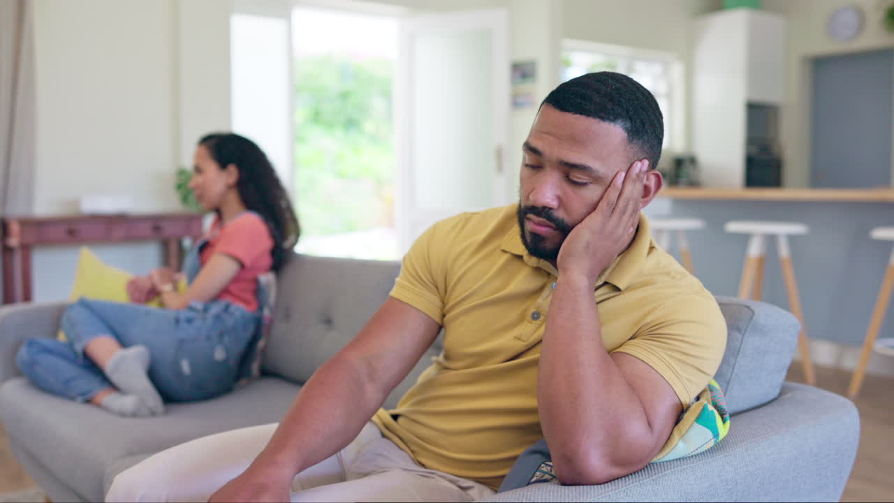 Premium stock video - Couple, separation and fight on sofa in argument