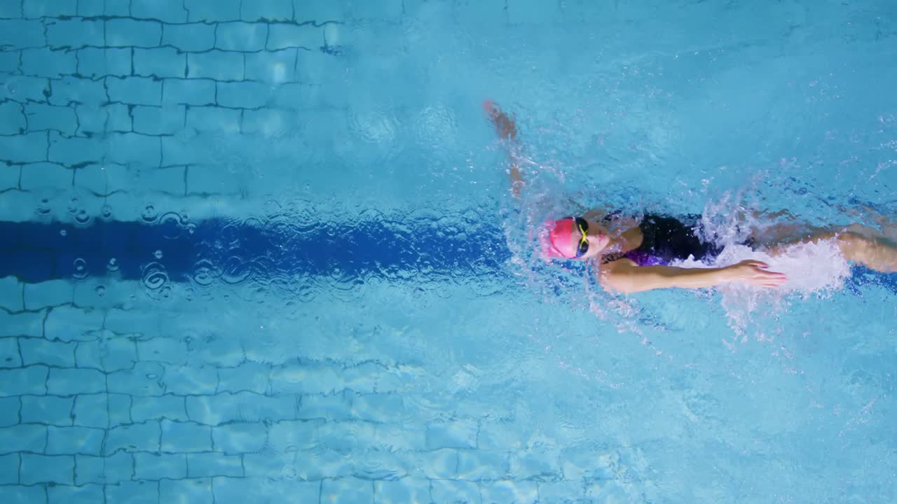 Premium stock video - Swimmer training in a swimming pool