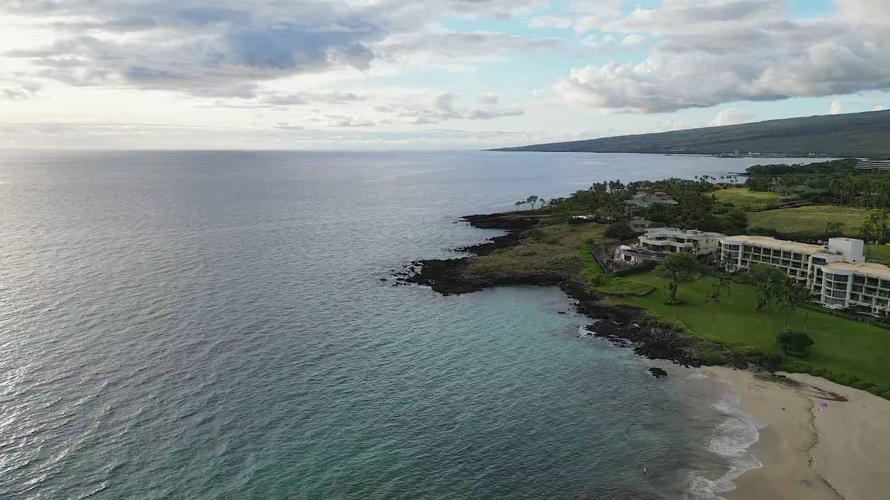 Amazing establishing aerial shot of Hapuna beach in Hawaii, lowering to ...