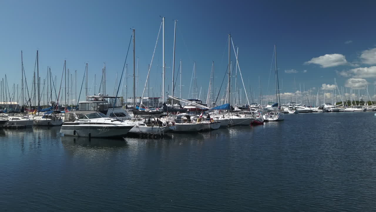 Wide shot of toronto sailboat marina and view of alexandra yacht club ...