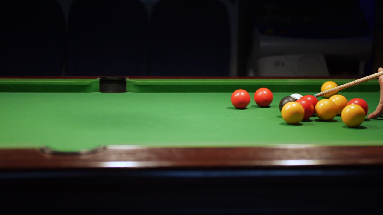 Potting A Red Ball In To A Center Pocket On A Green Pool Table In A Bar ...