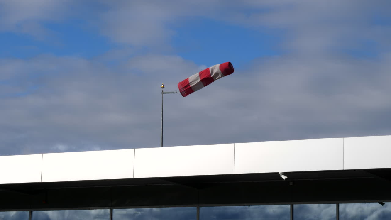 An Isolated Windsock At An Airfield In Heavy Winds To A Backdrop Of ...