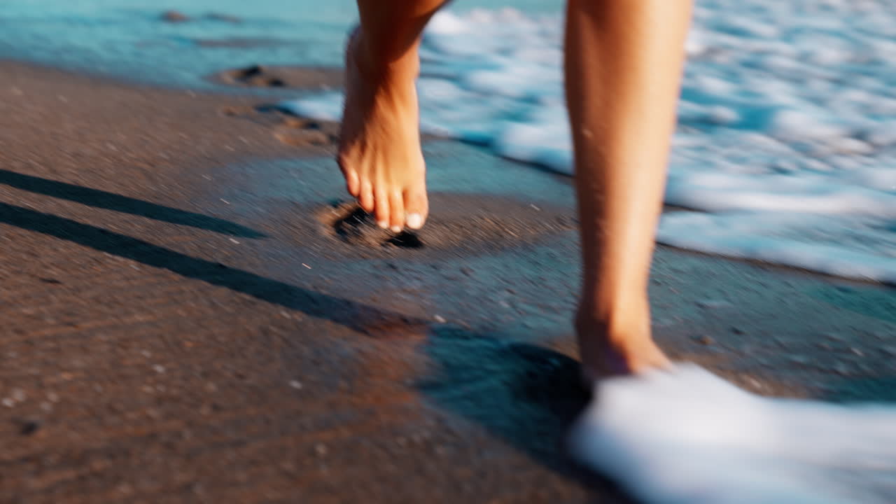 Premium stock video - Pretty girl slow motion walking on wet sand on beach