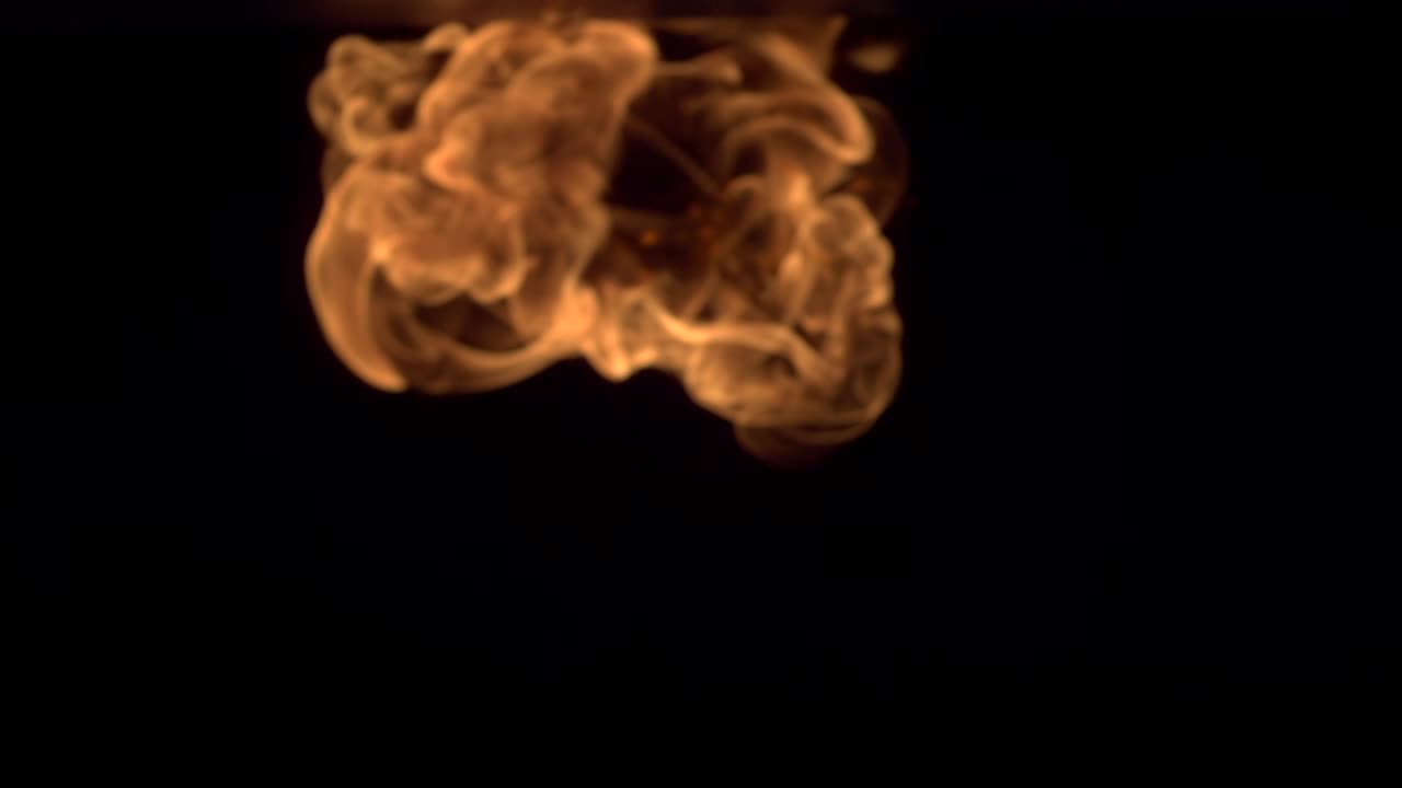 Yellow, orange fire explosion, burst top down view, isolated black ...