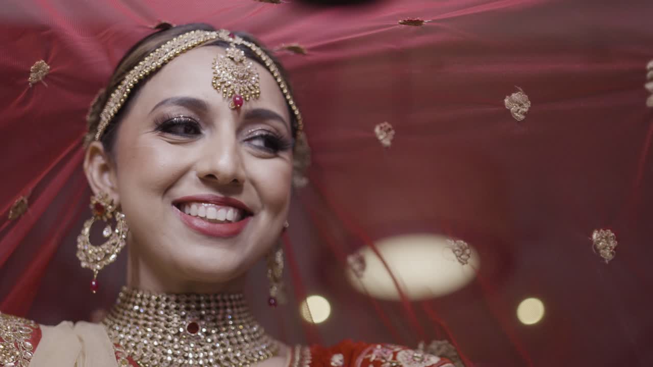 Premium stock video - Beautiful indian bride with her red traditional ...