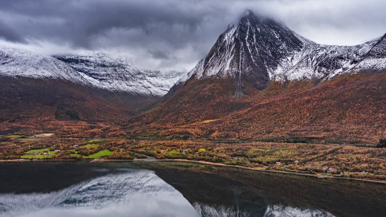 Premium stock video - Stormy clouds passing above the rust-colored tundra