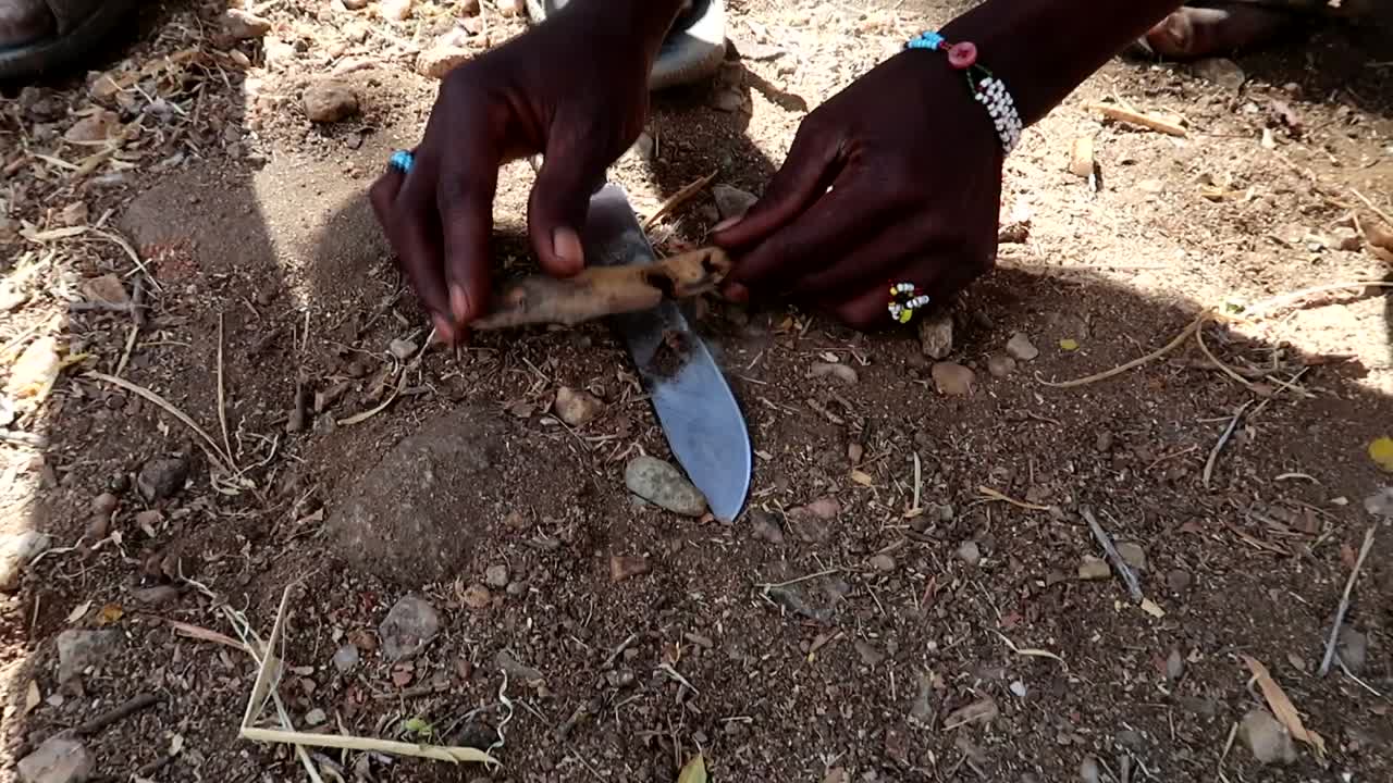 Close Up Shot Of A Bushman Making Fire With A Dry Stick, Embers ...