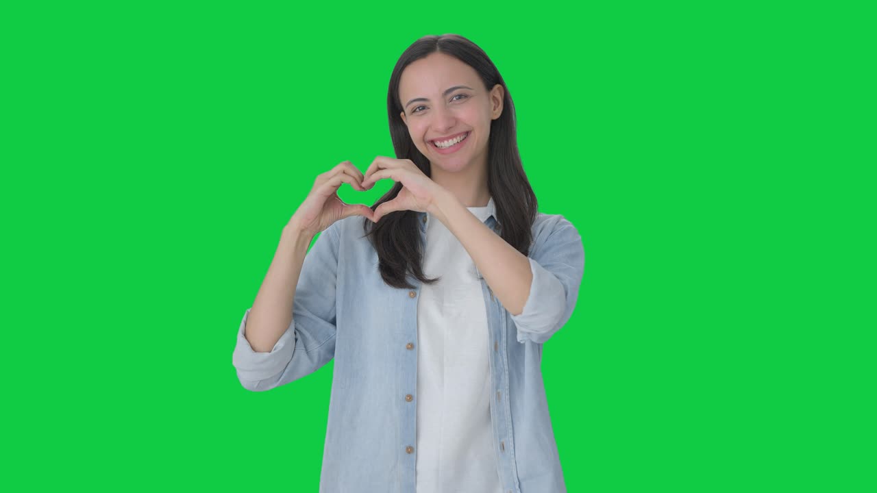 Happy Indian Girl Showing Heart Sign Green Screen Free Stock Video ...