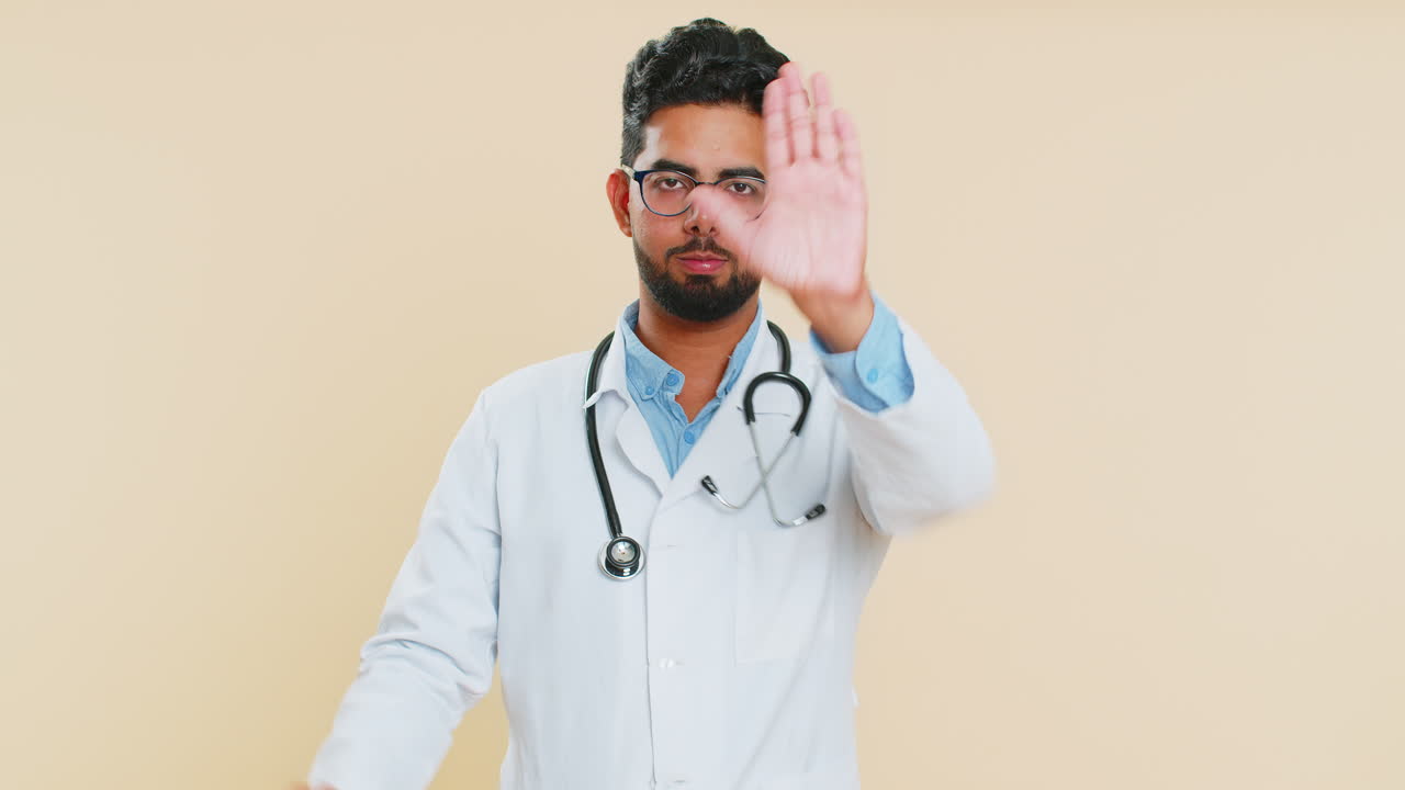 Doctor man say no hold palm folded crossed hands in stop gesture ...