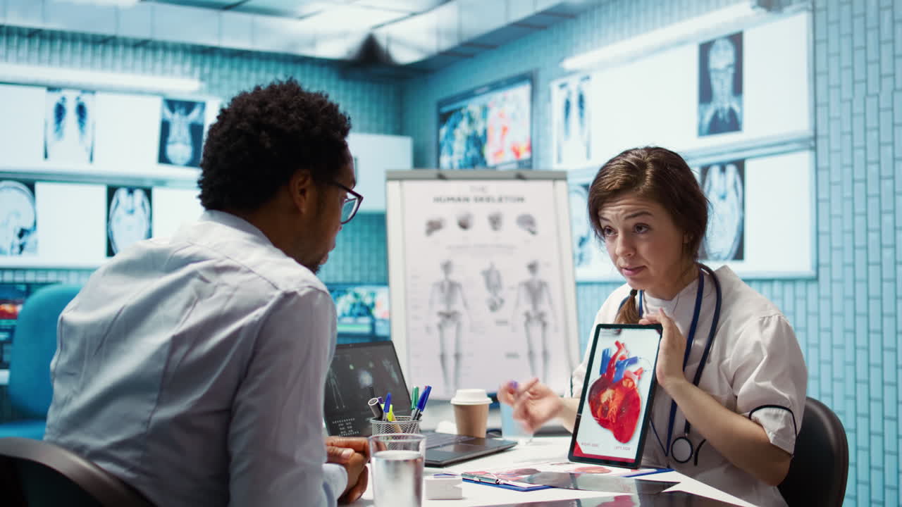 Premium stock video - Healthcare provider cardiologist explains heart ...