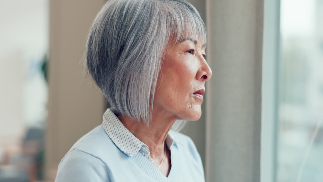 Premium stock video - Thinking, senior and woman with memory at window