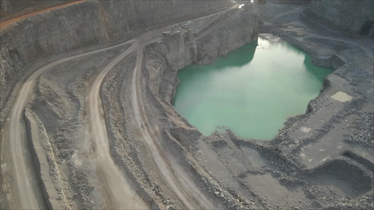 Premium stock video - 4k reveal shot of rock quarry
