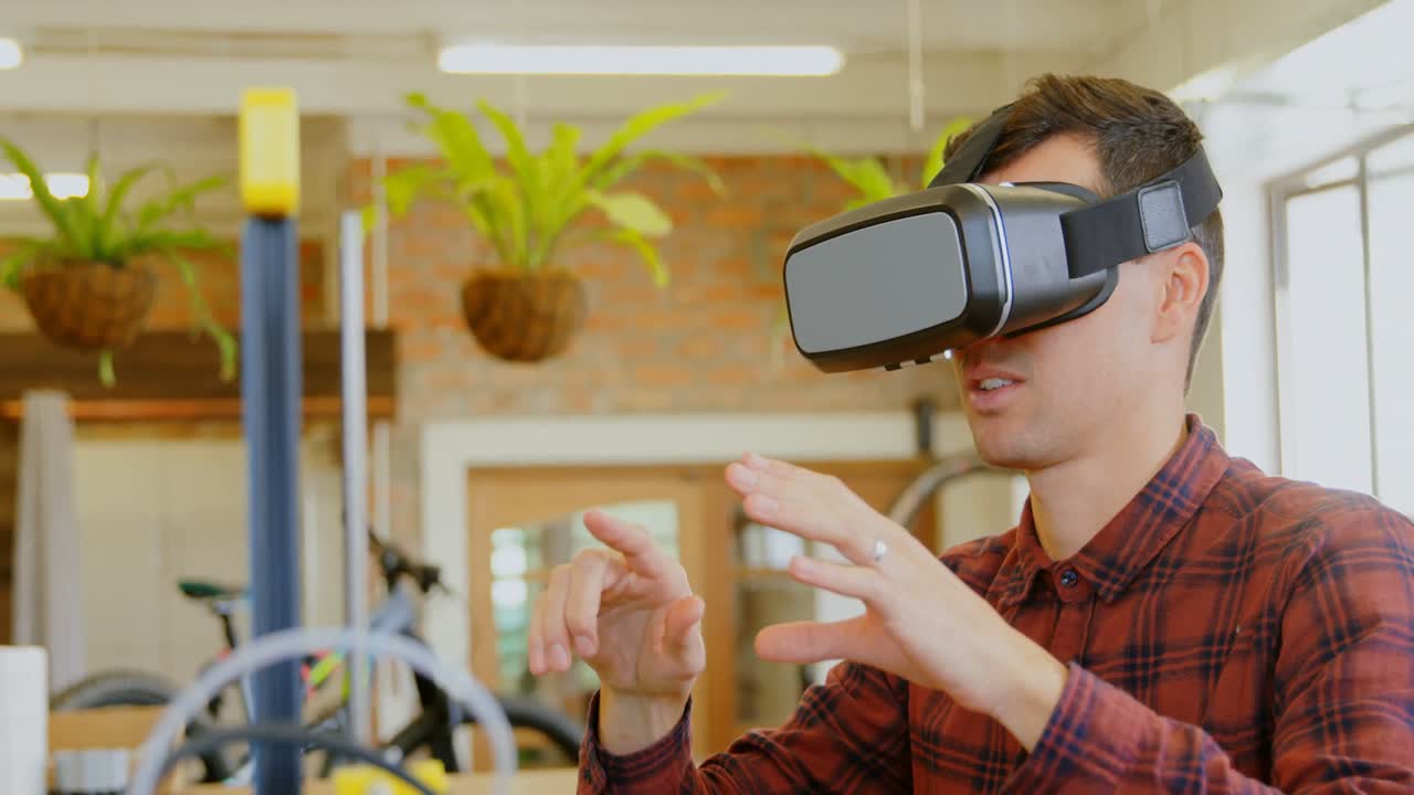 Premium stock video - Mechanic using virtual reality headset 4k
