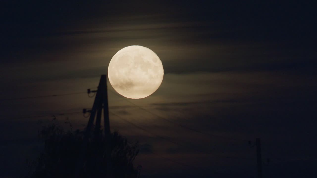 Dramatic Low Moon Rise Through Thin Cloud Layer And Electric Pole Time ...