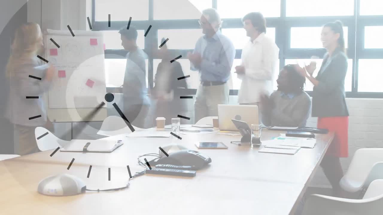 Colleagues in a busy office and clock ticking | Premium Stock Video Footage