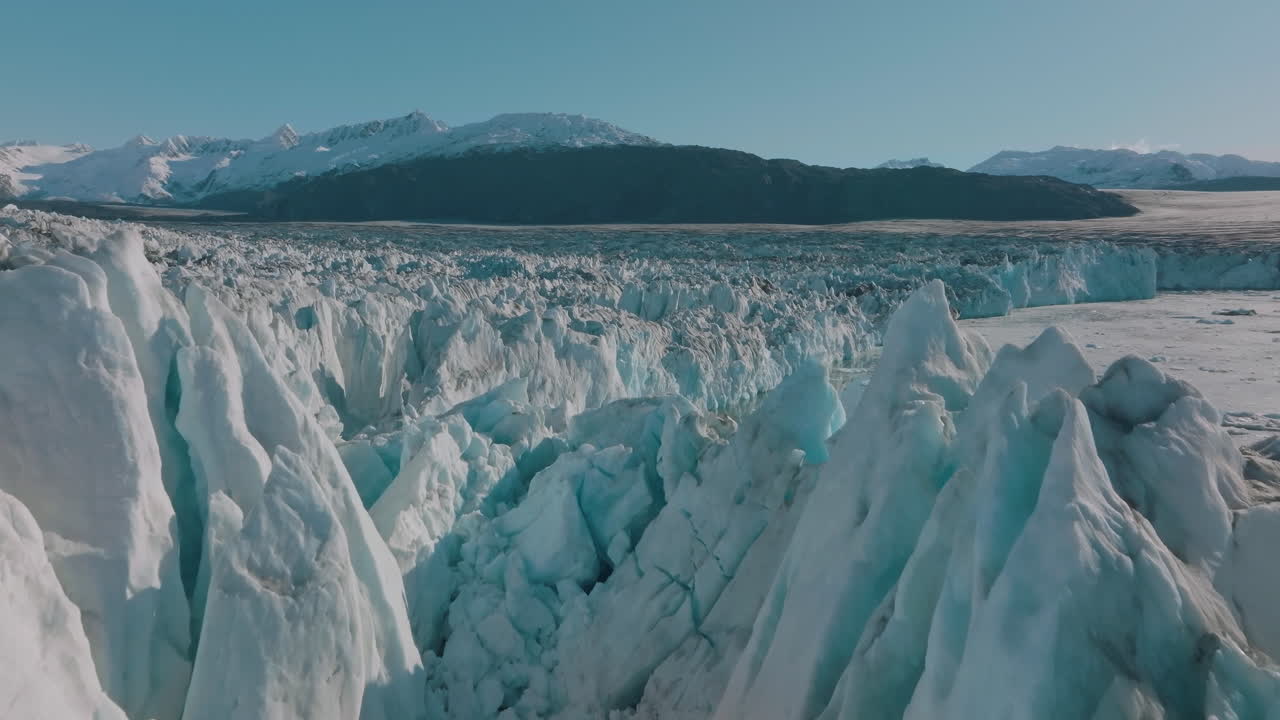 Premium stock video - Spectacular aerial view flying over a glacial ice ...