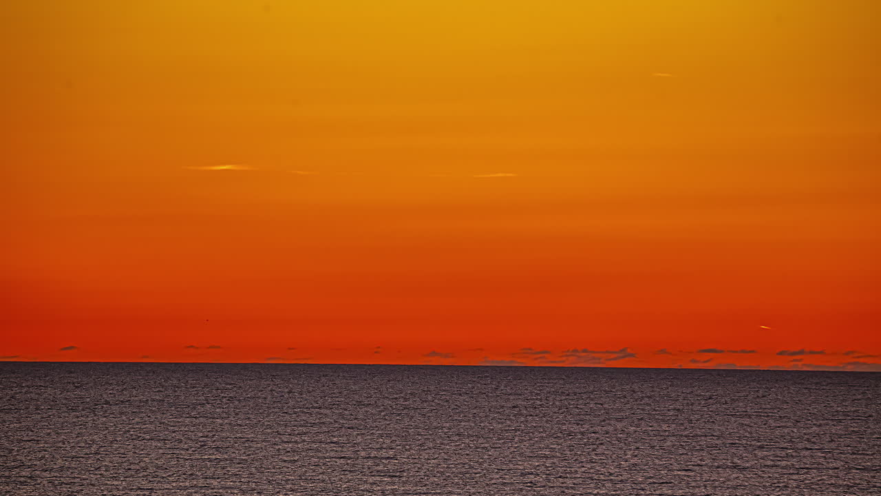 Time Lapse View Of The Sea Disappearing Into The Horizon Of The Orange ...