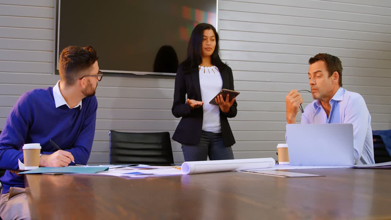 Executives discussing in conference room 4k Premium Stock Video Footage