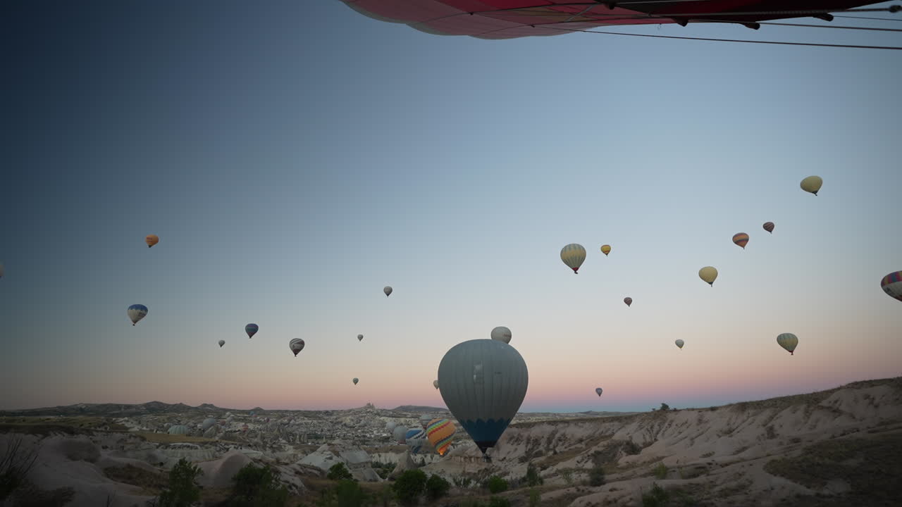 Flying in hot air balloon in cappadocia turkey, view of parachutes from ...