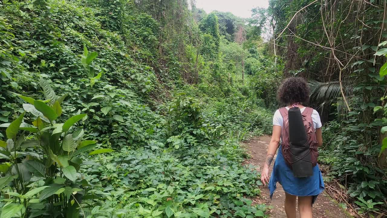 Brazilian girl walking in the rainforest Premium Stock Video Footage