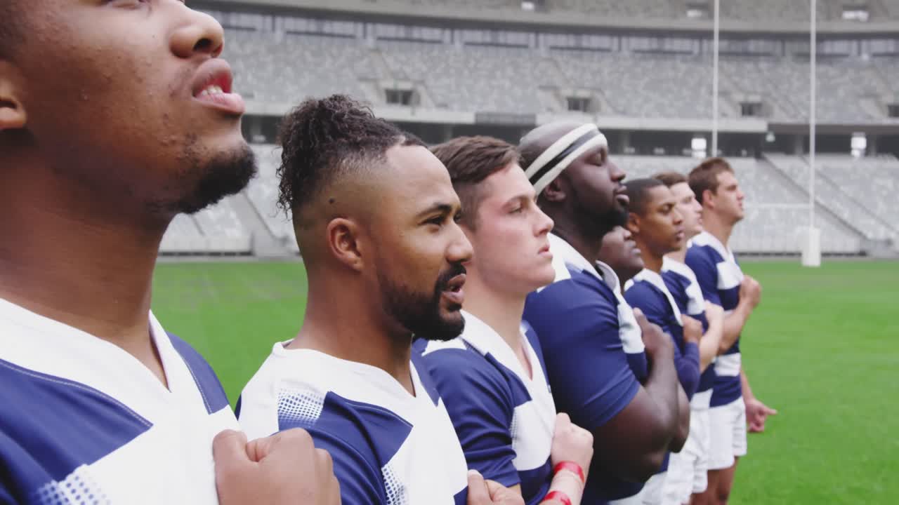 Premium stock video - Male rugby players taking pledge together in ...