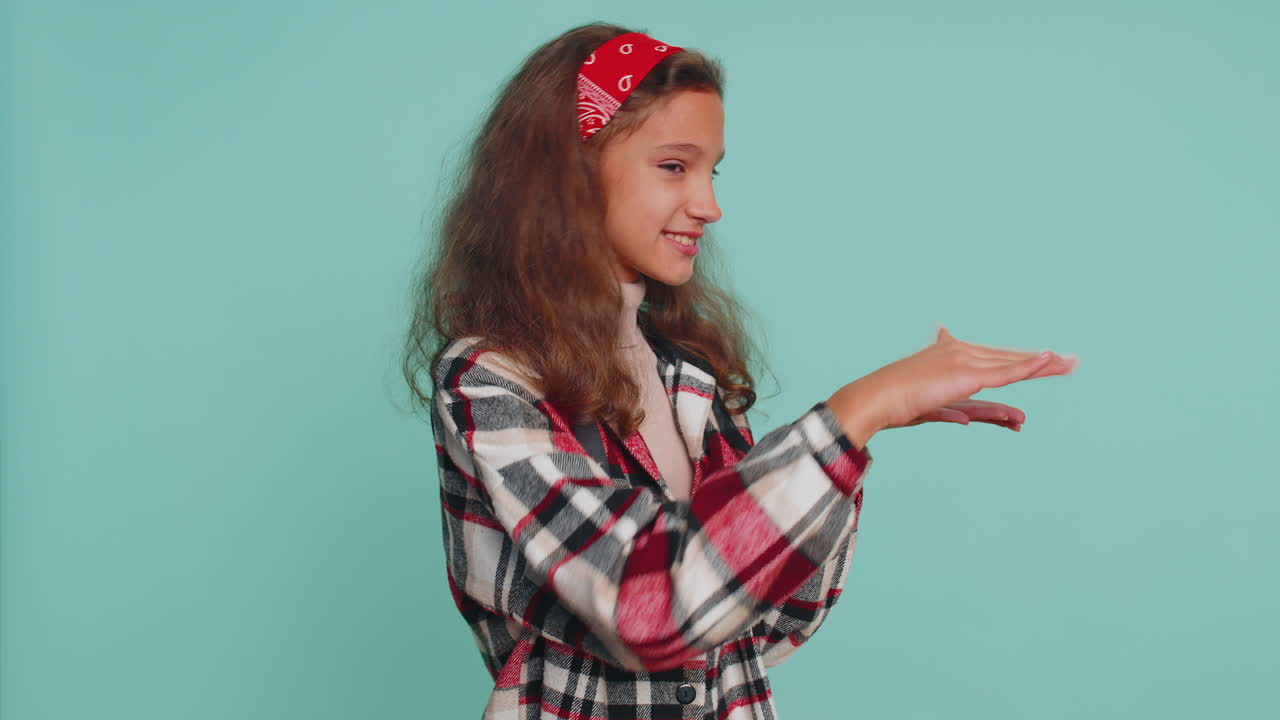 Child girl showing wasting throwing money around hand gesture lottery ...