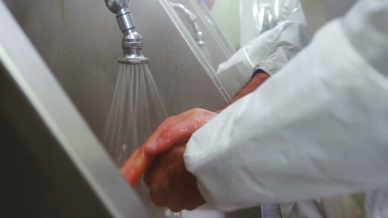 Team of butcher washing hands Premium Stock Video Footage