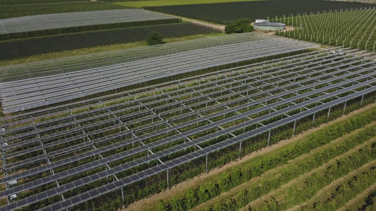Premium stock video - Agrivoltaics solar farm for sustainable food and ...
