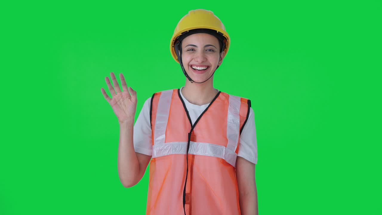 Premium stock video - Happy indian female construction worker waving hi ...
