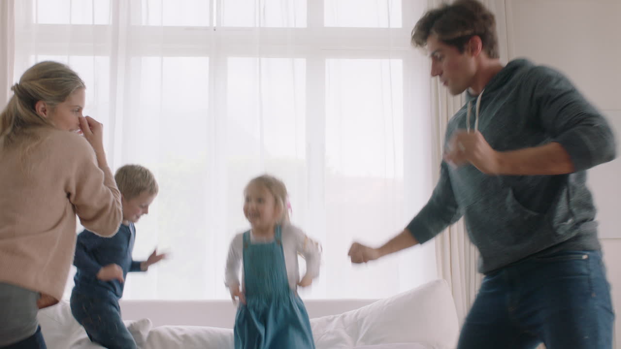 Happy family dancing at home having fun dance celebrating together ...