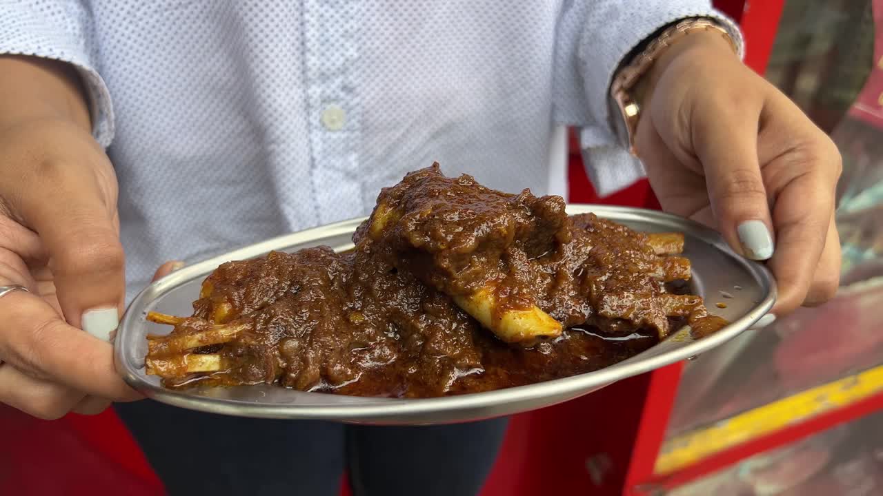 Premium stock video - Spicy mutton prepared in handi style in bihar