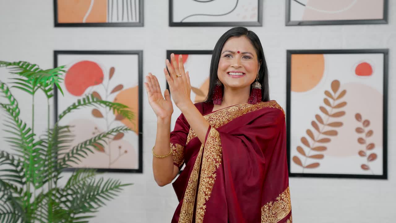 Premium stock video - Happy indian woman clapping