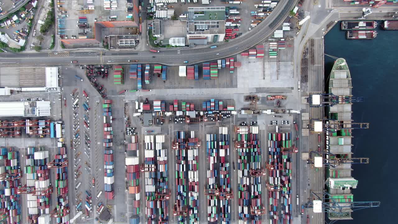 Mega Container Ship Docked At Hong Kong Port, During Loading And Unloading Operation, Aerial ...