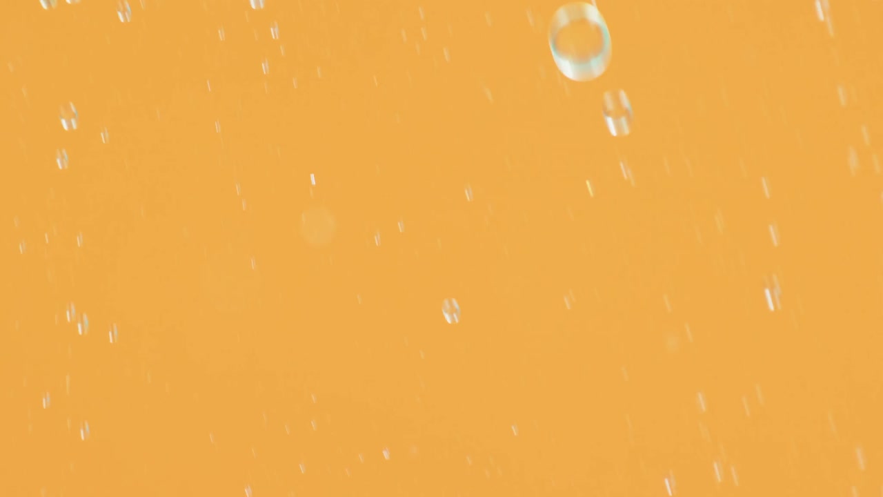 Animation of bubbles moving on orange background with copy space ...