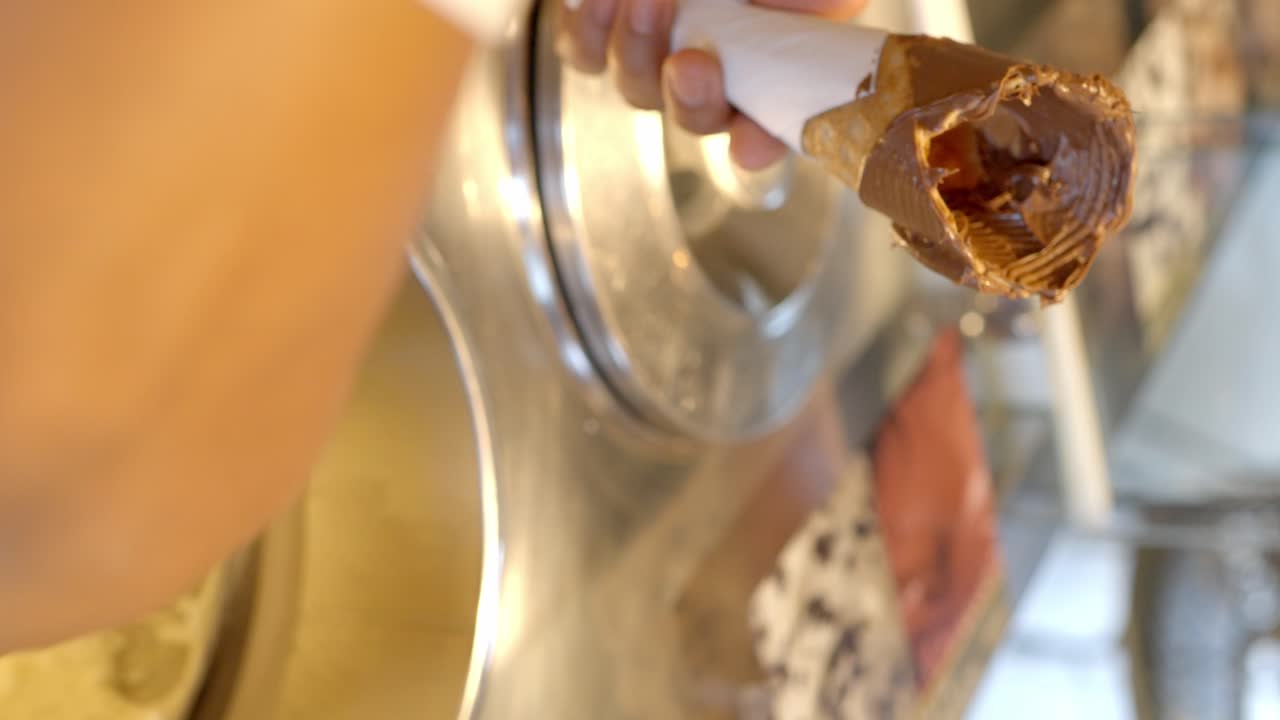 Ice Cream Shop Worker Serving Vanilla Ice Cream In An Ice Cream Cone ...