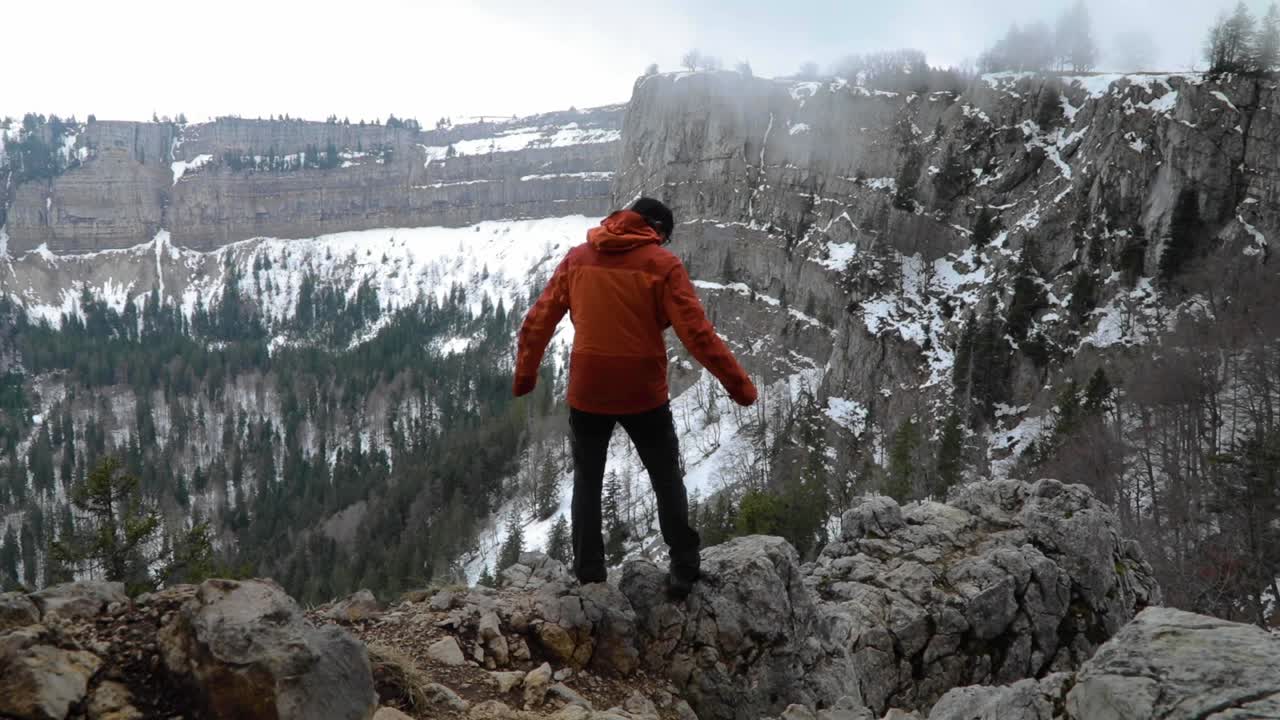 Man Stand On Cliff Edge Overlook Winter Landscape, Raising Arms Free ...