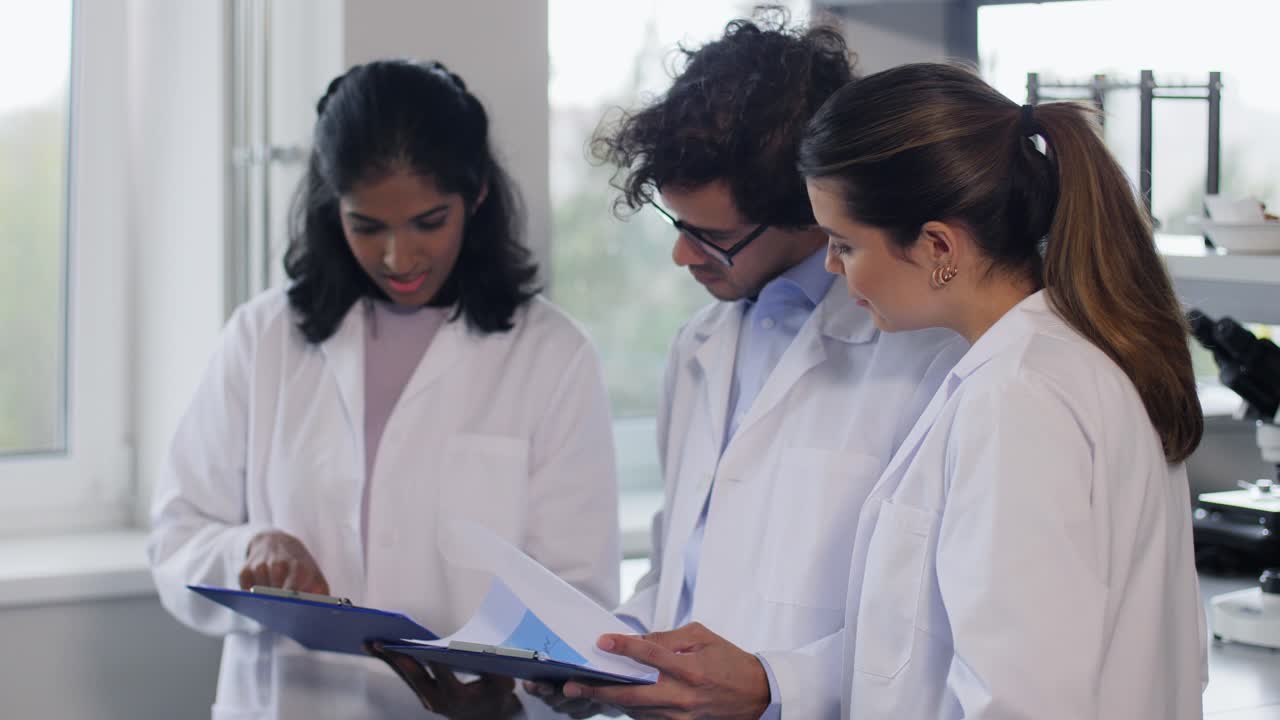 Premium stock video - International group of scientists in laboratory ...