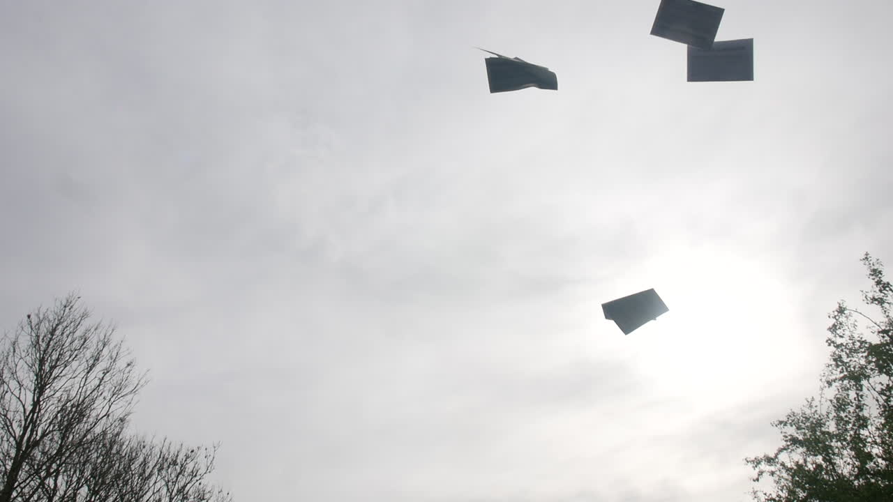Premium stock video - Paper sheets flying in the air against a cloudy ...