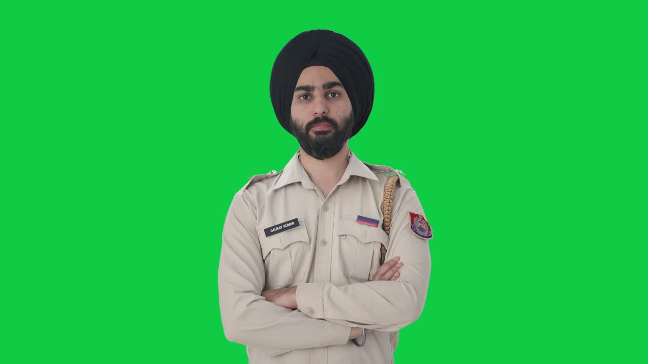 Premium stock video - Confident sikh indian police man standing crossed ...