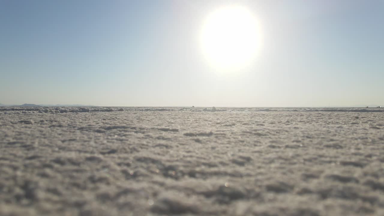 Premium stock video - Stationary ground level shot of the salt flats ...