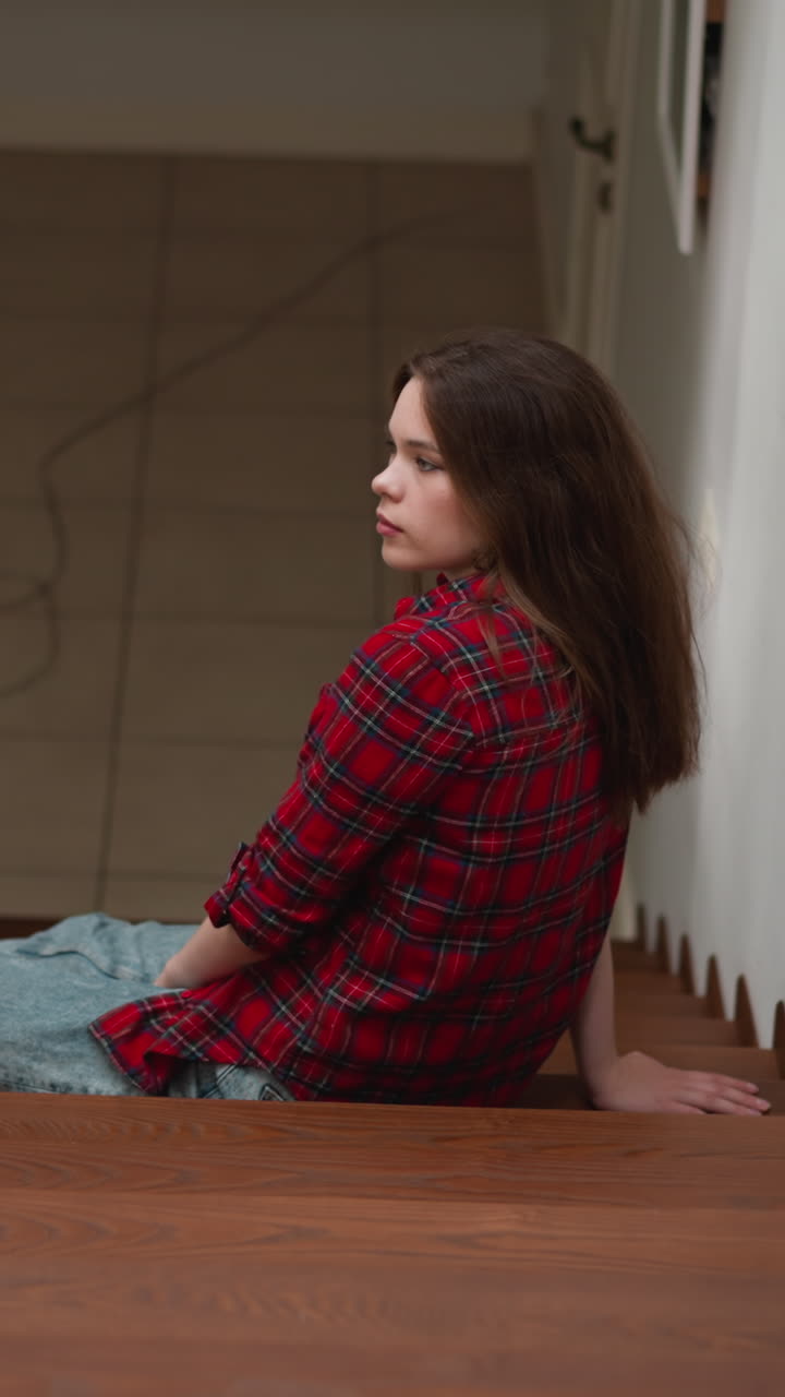 Woman thinks about failures sitting on steps. Pensive lady with loose ...
