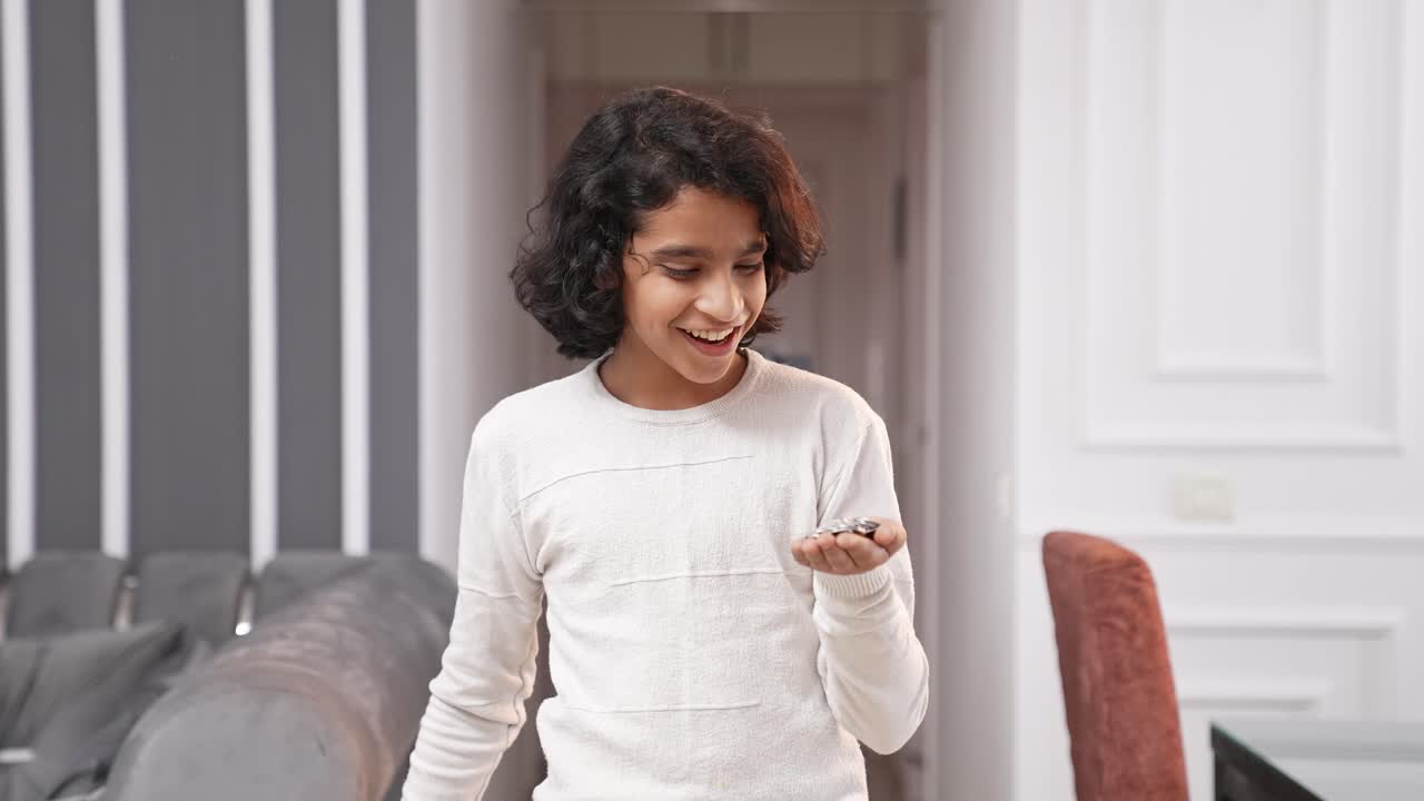 Premium stock video - Happy and smiling indian kid boy with lots of ...