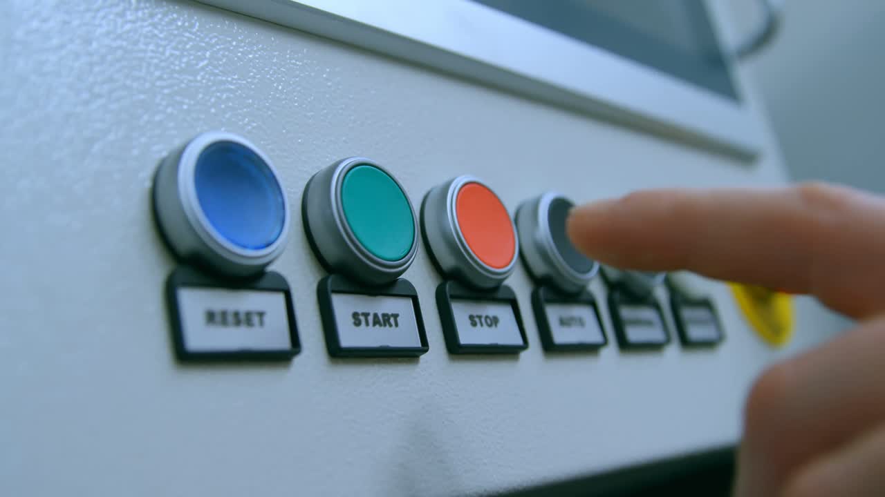 Premium stock video - Robotic engineer pushing control panel button 4k