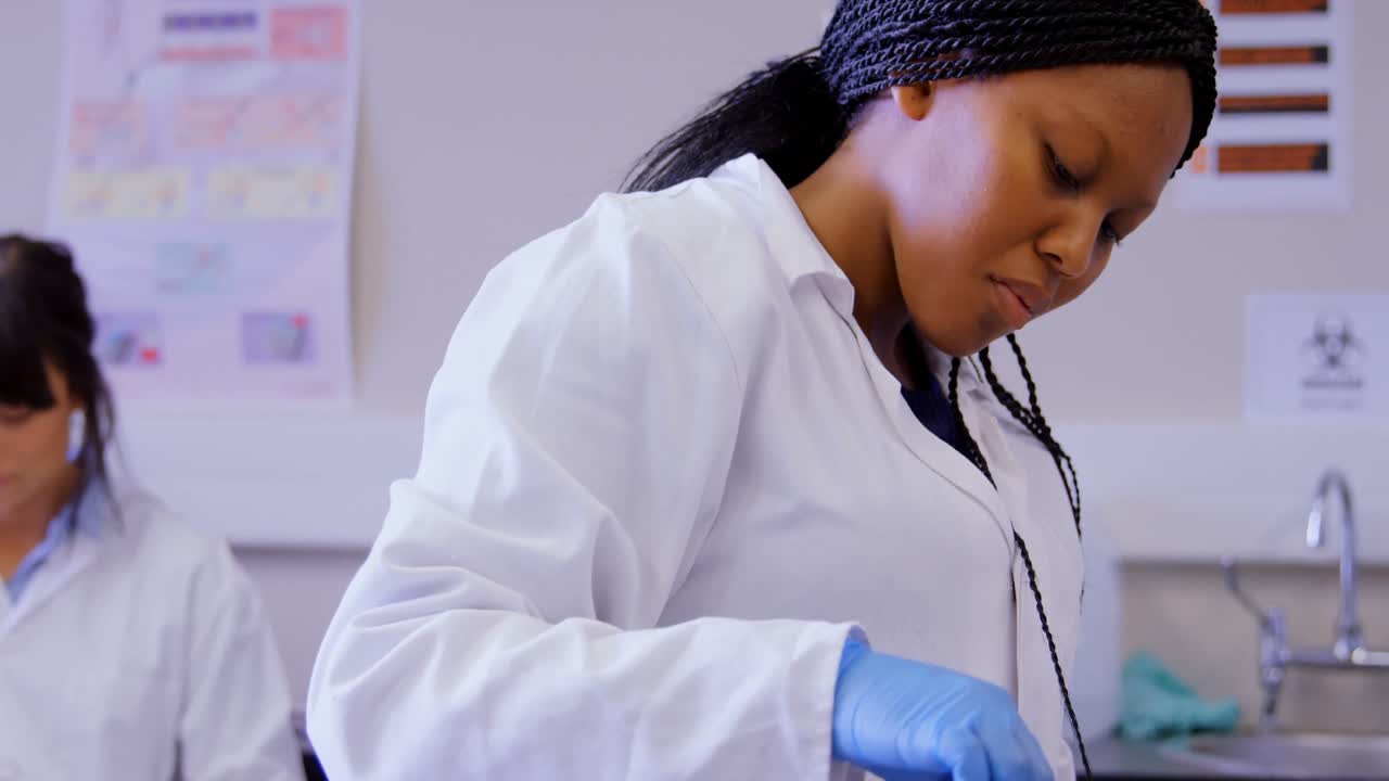 Premium stock video - Laboratory technician analyzing blood plasma 4k