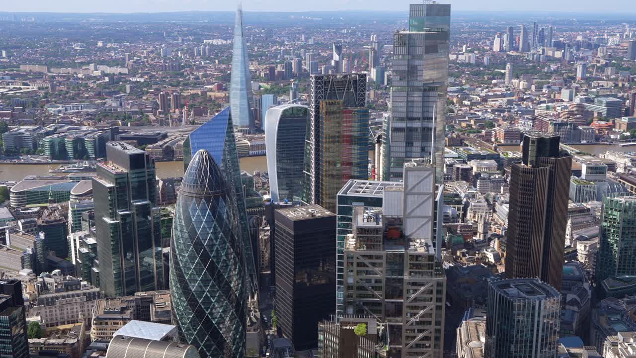 Premium stock video - Close up aerial view of the city of london towers from north to south