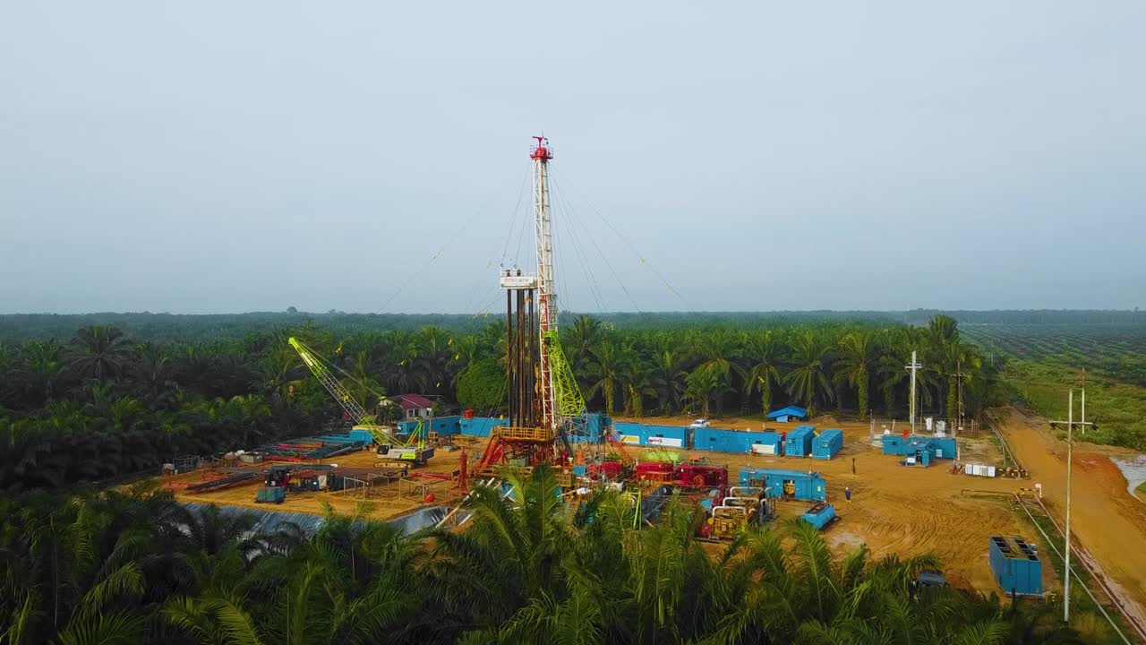 Premium stock video - Cinematic drone shot of onshore drilling and ...