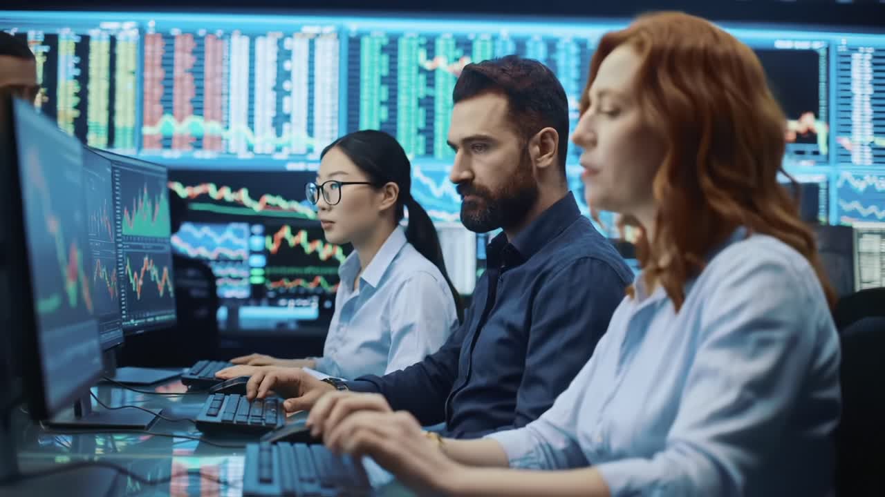 Analysts Collaborating in a High-Tech Trading Environment, Analyzing ...
