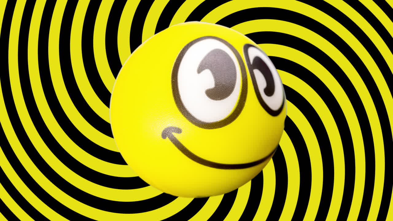 Premium stock video - Smiley emoji face turning