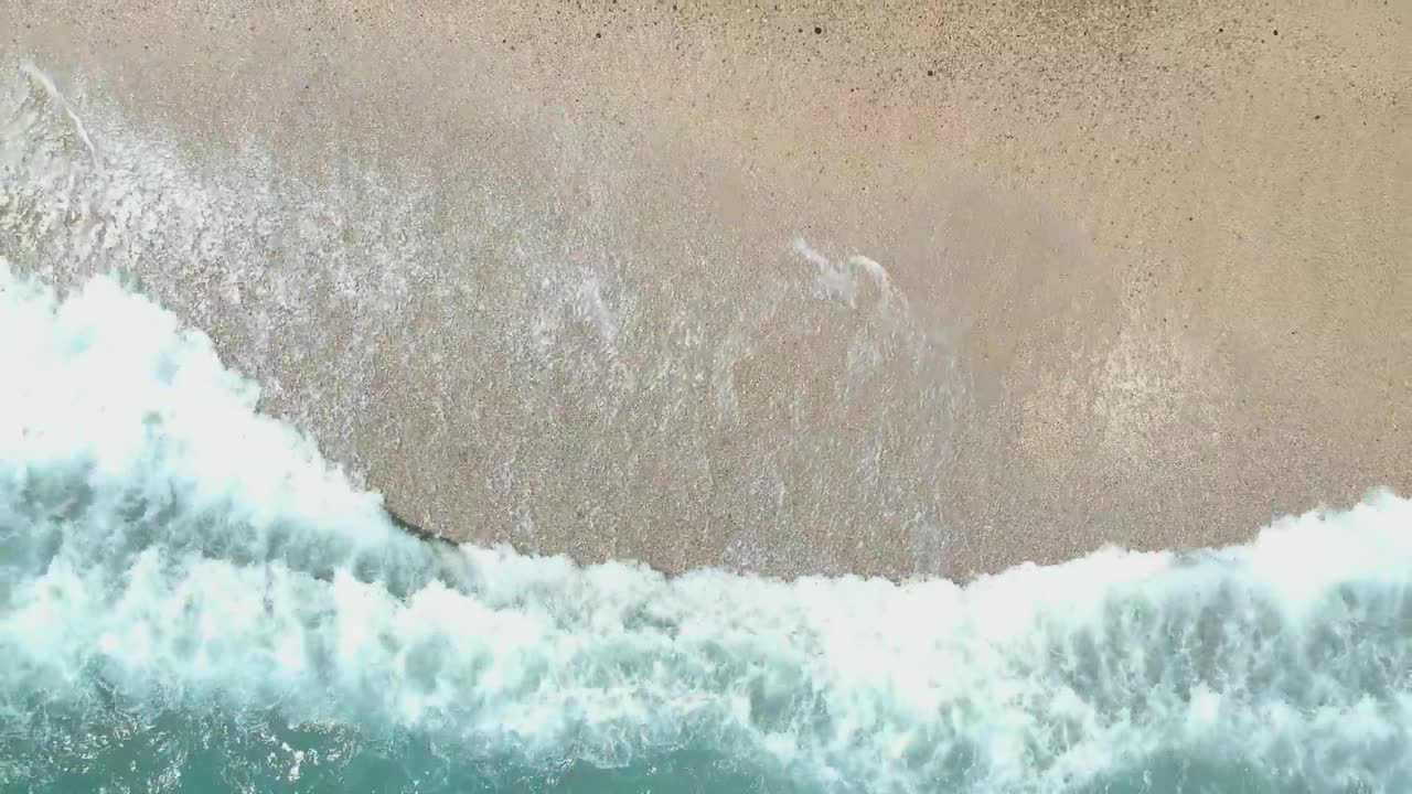 Premium stock video - Ascending aerial view from drone over waves ...