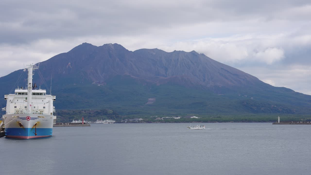 Kagoshima bay and harbor, ships and sakura-jima volcano in the ...